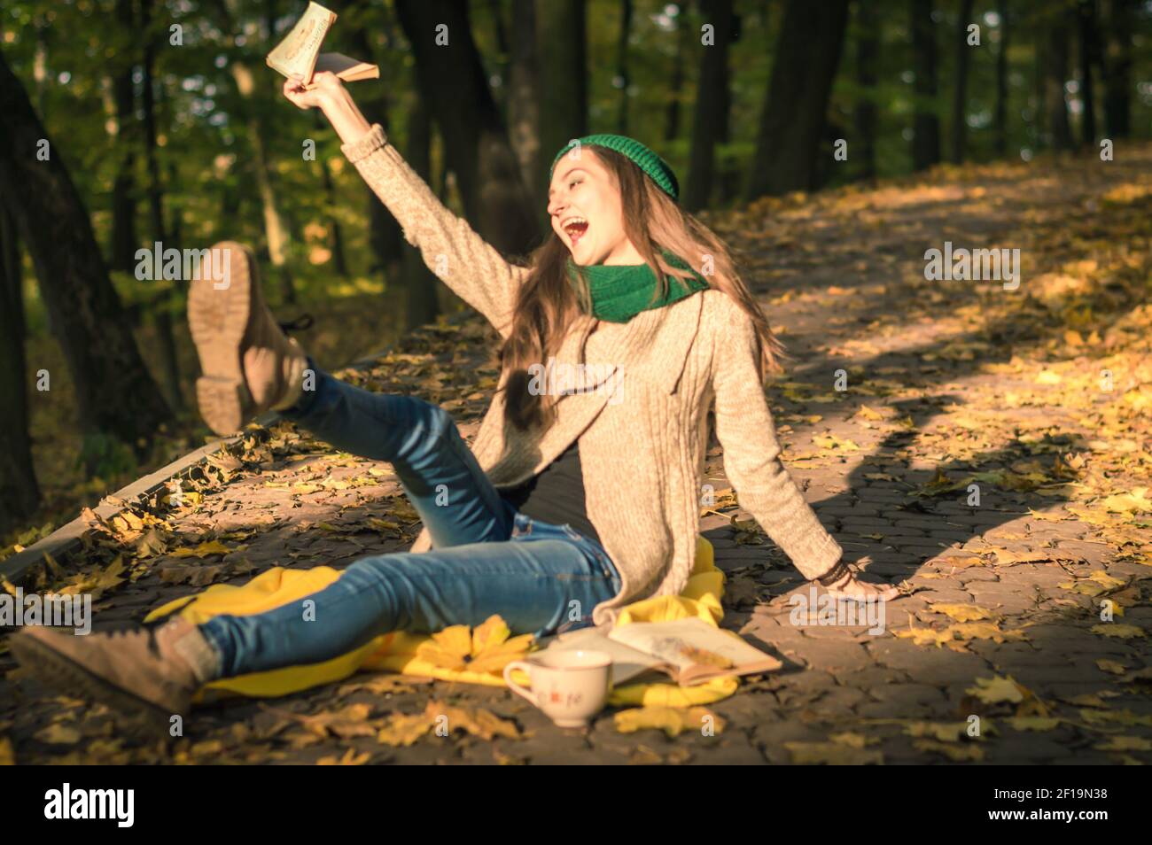 Girl enjoys reading a book Stock Photo - Alamy
