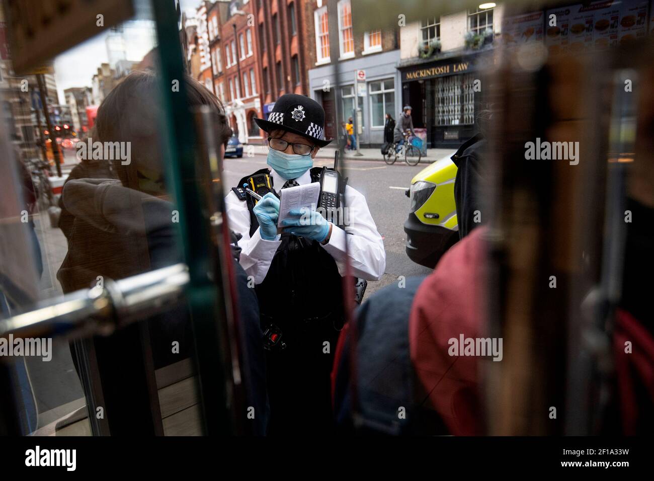 Police officer questions suspect hi-res stock photography and images ...