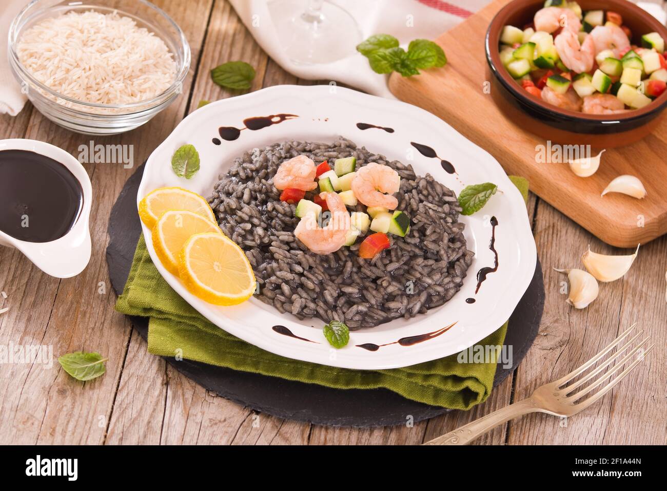 Squid ink risotto Stock Photo - Alamy