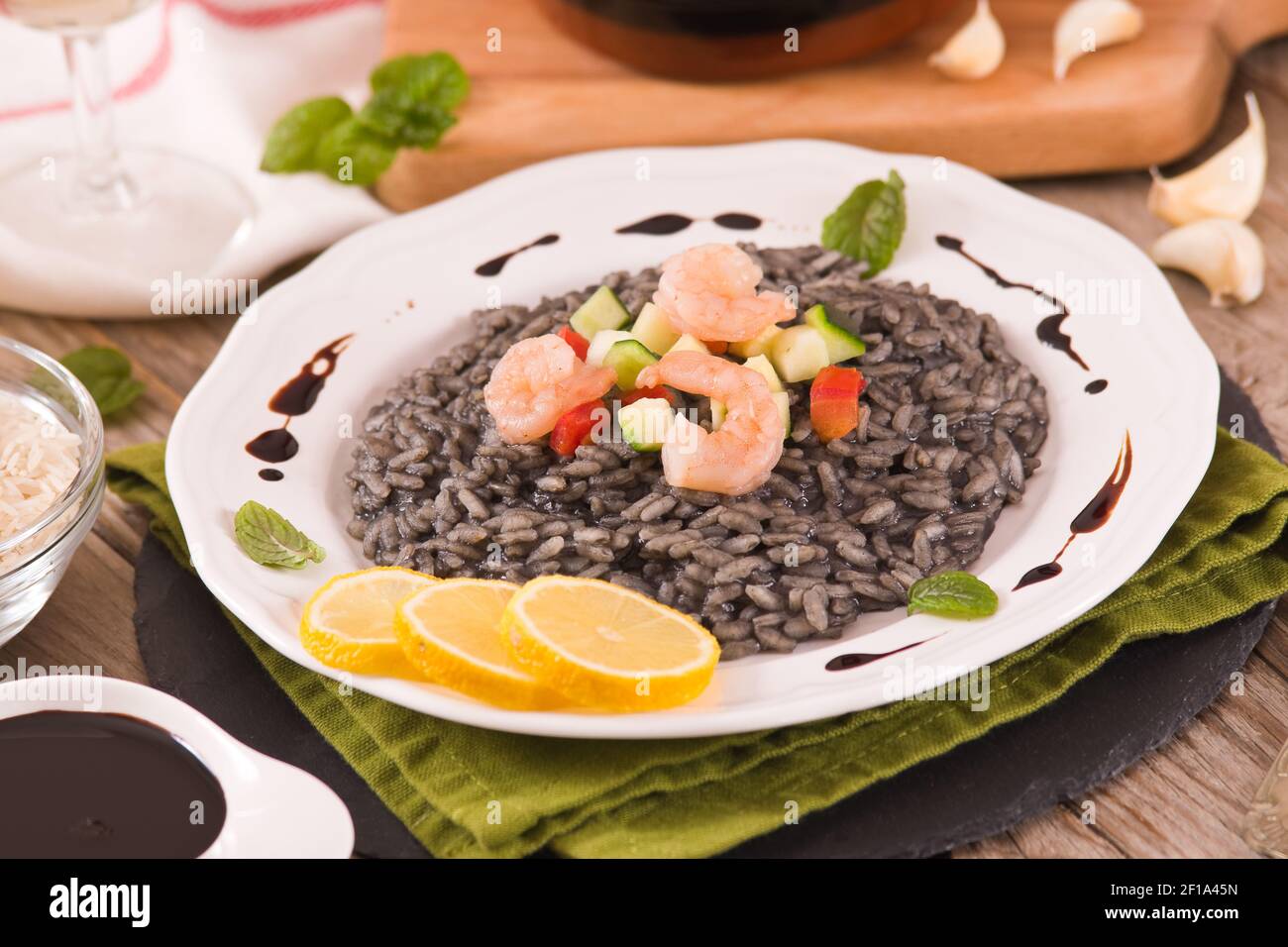 Squid ink risotto Stock Photo - Alamy