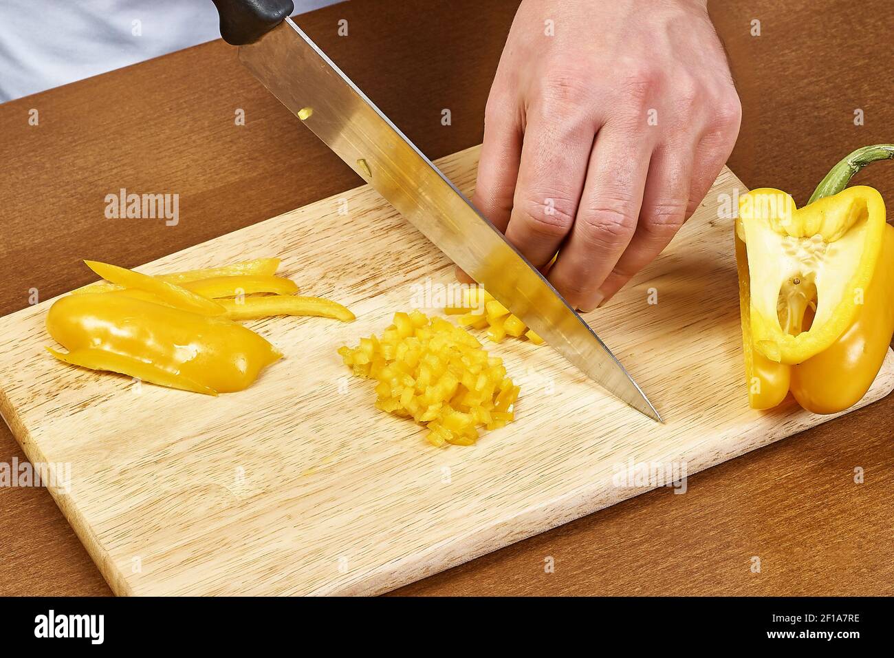 Cook cutting red sweet pepper hi-res stock photography and images - Alamy