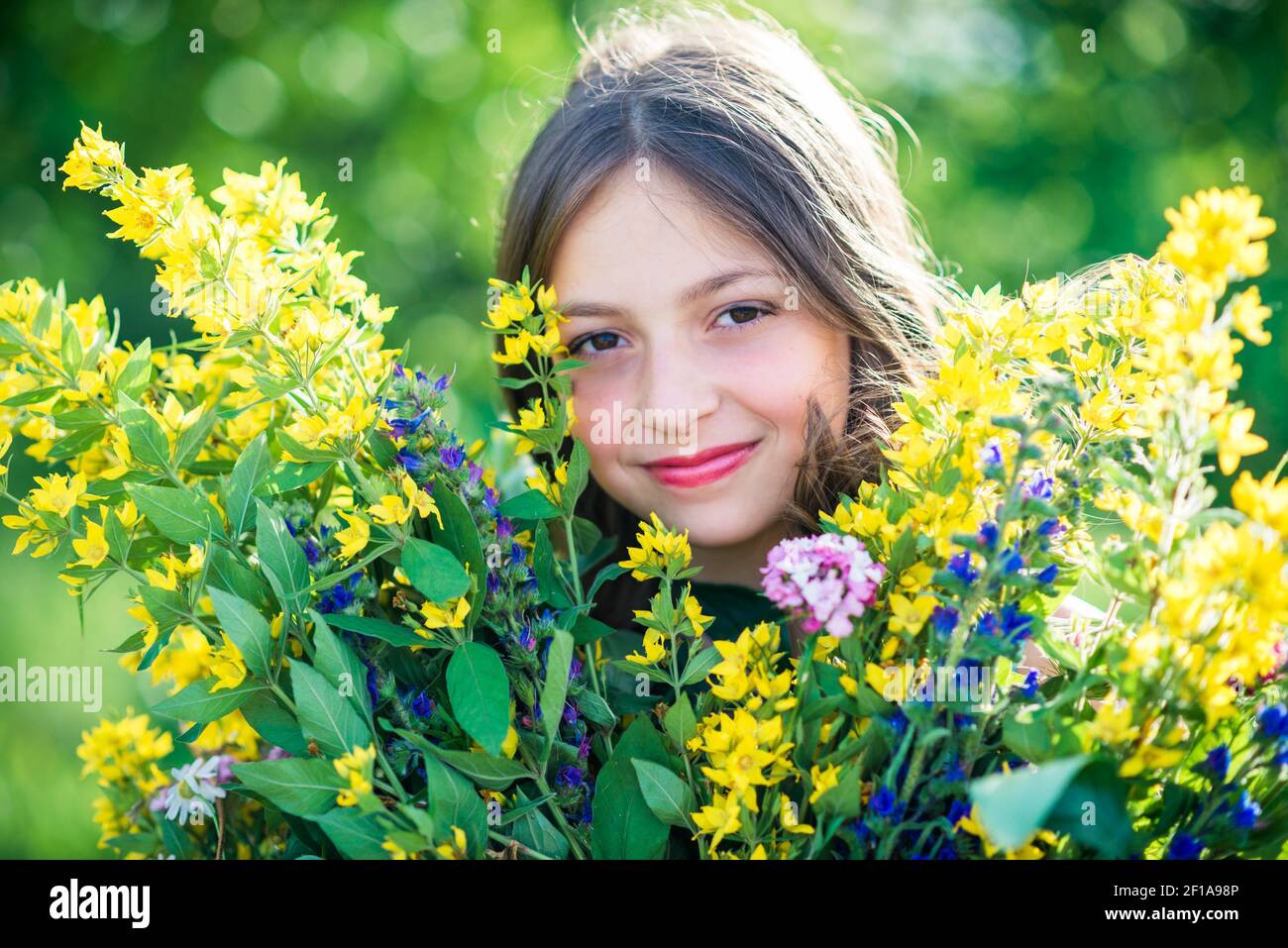 Smiling modern girl holding hi-res stock photography and images - Alamy