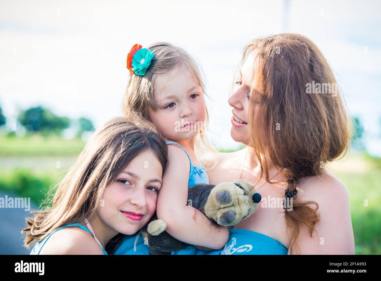 Portrait of mother and two daughters Stock Photo - Alamy