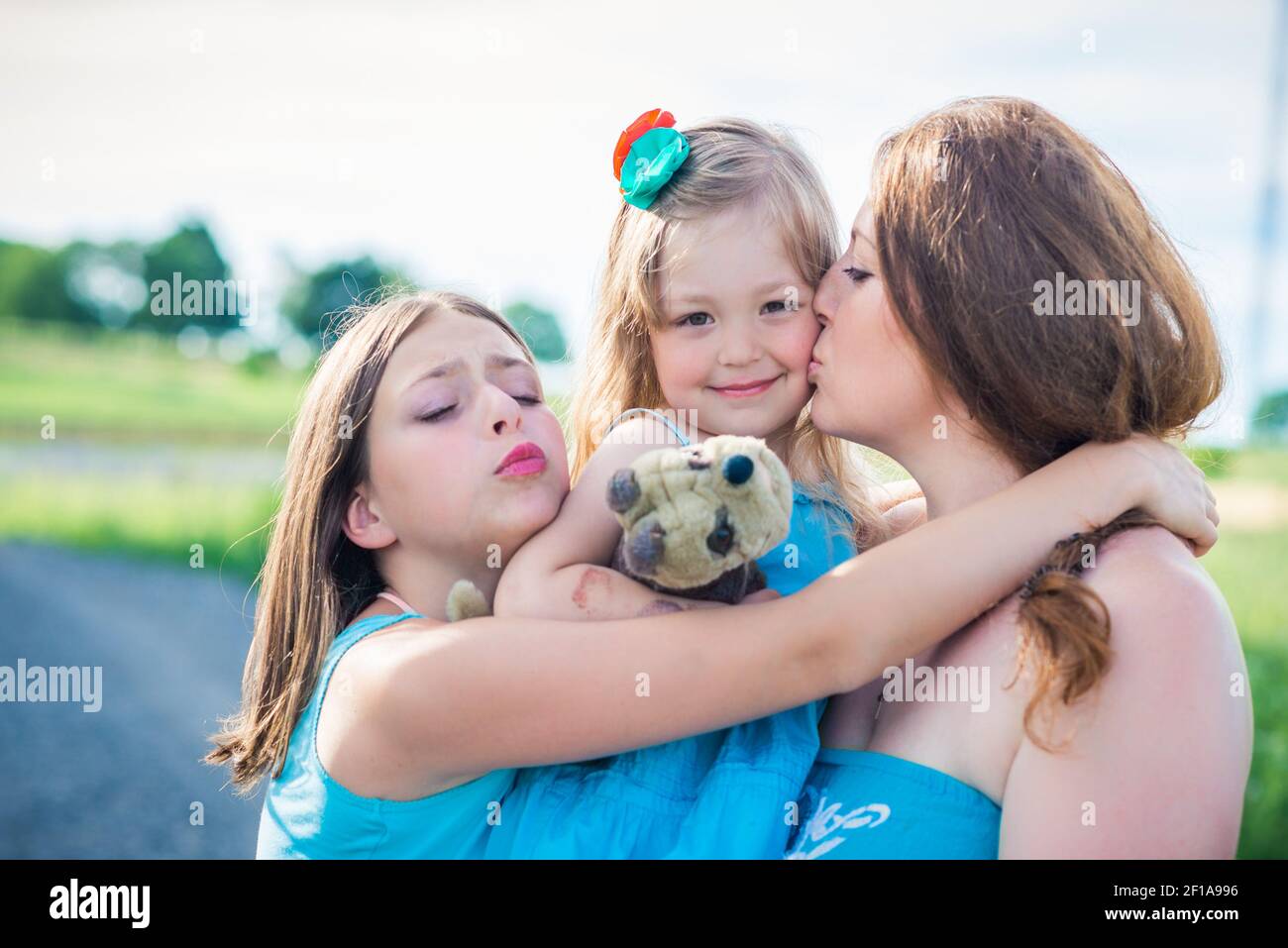 Portrait of mother and two daughters Stock Photo - Alamy