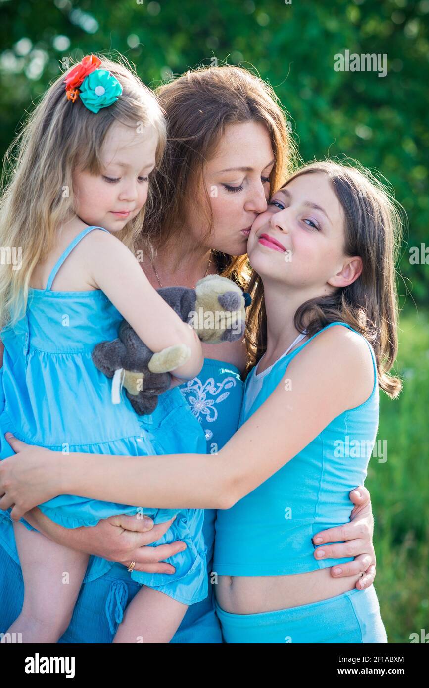 Portrait of mother and two daughters Stock Photo - Alamy