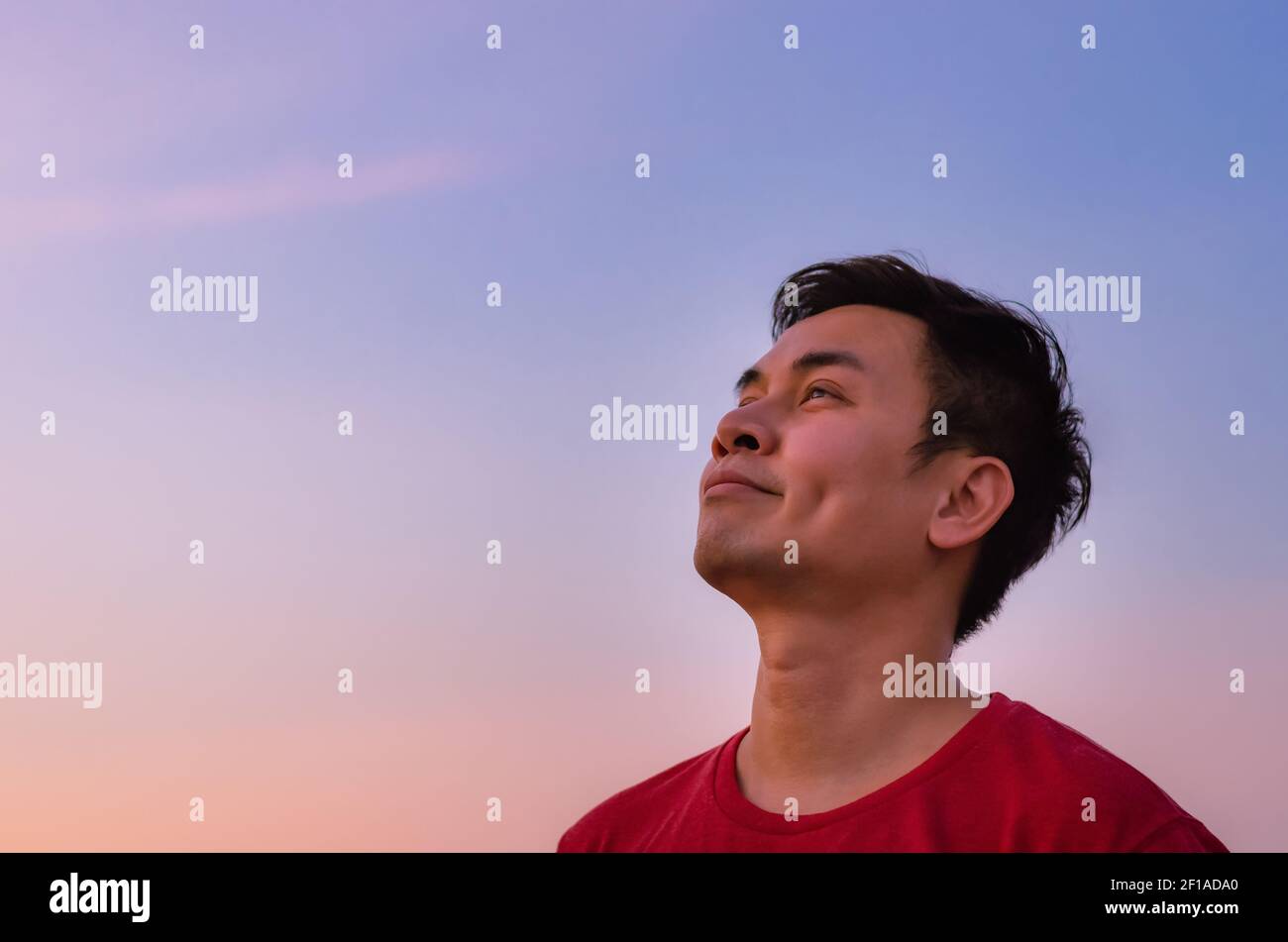 Asian man looking up to sky. Positive mental health and emotion face ...