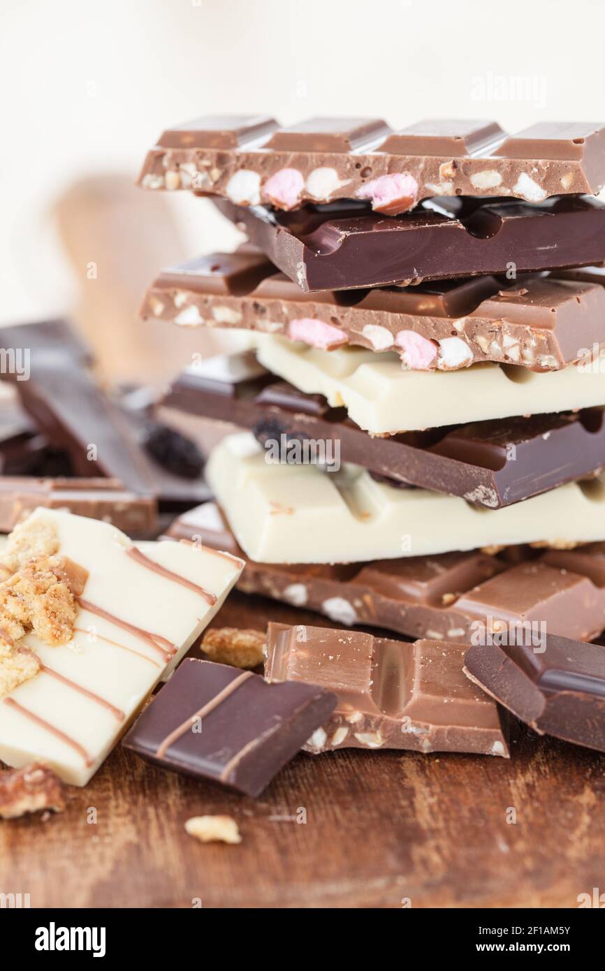 Various chocolate stacked Stock Photo - Alamy