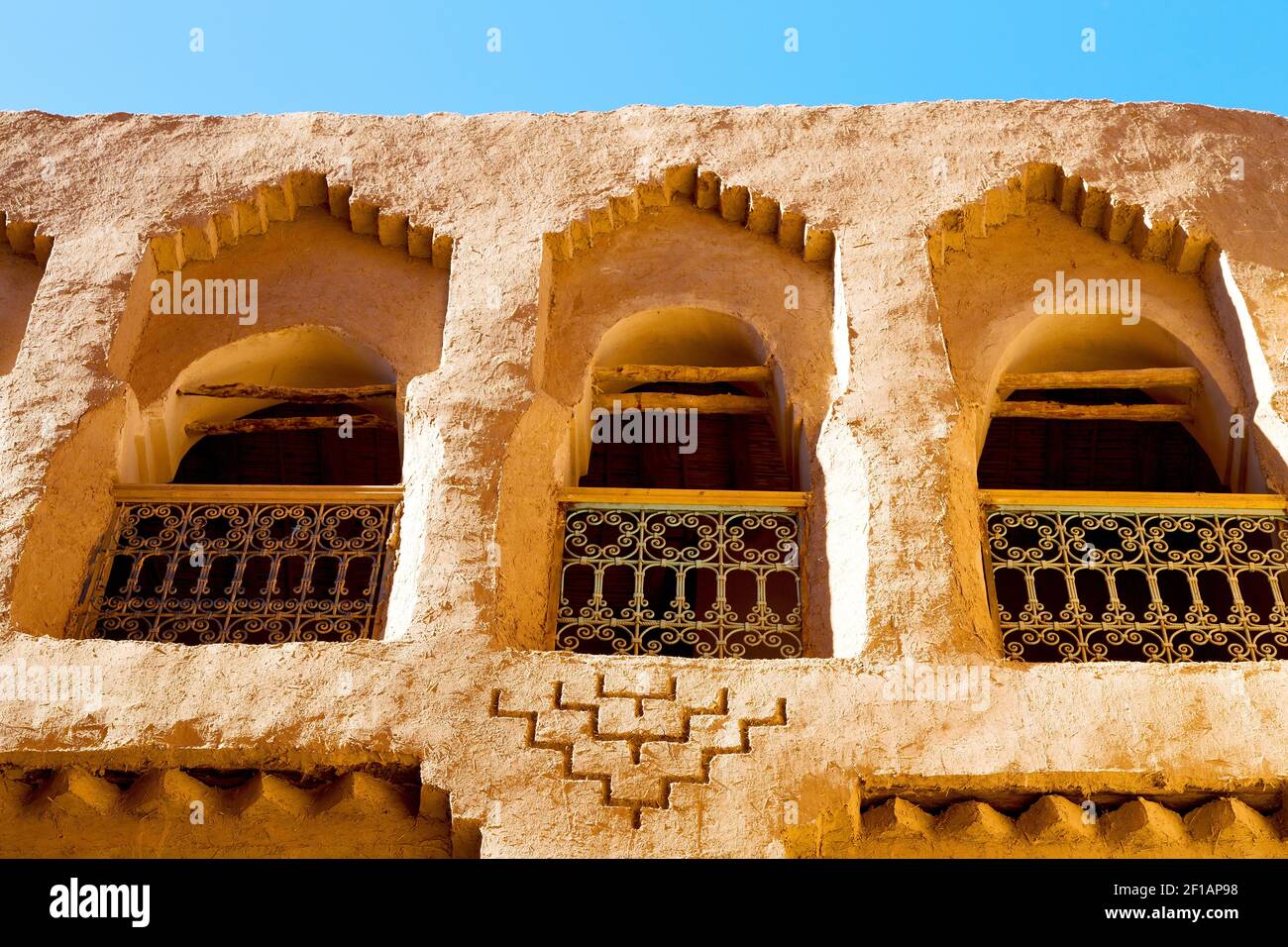Yellow window in morocco africa old construction and brown wall Stock ...