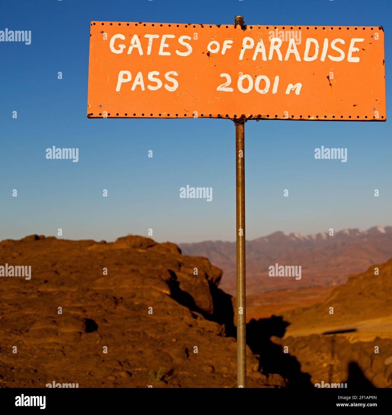 In road sign gate of paradise pass Stock Photo - Alamy