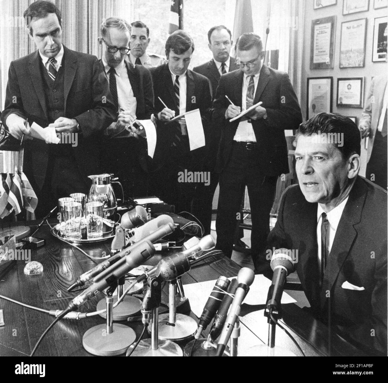 California Gov. Ronald Reagan, right, discusses the assassination of ...