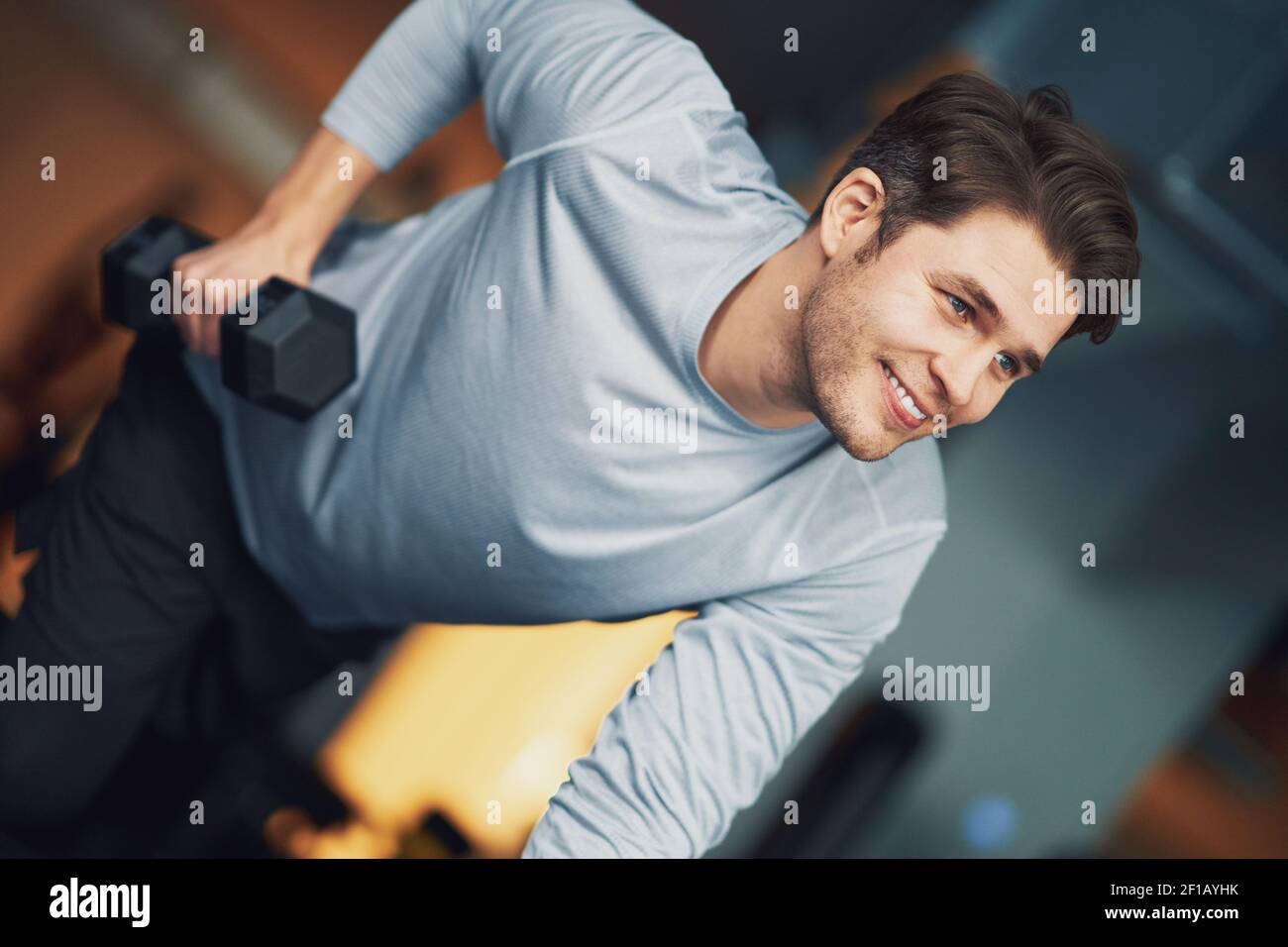 Adult man working out in a gym Stock Photo - Alamy