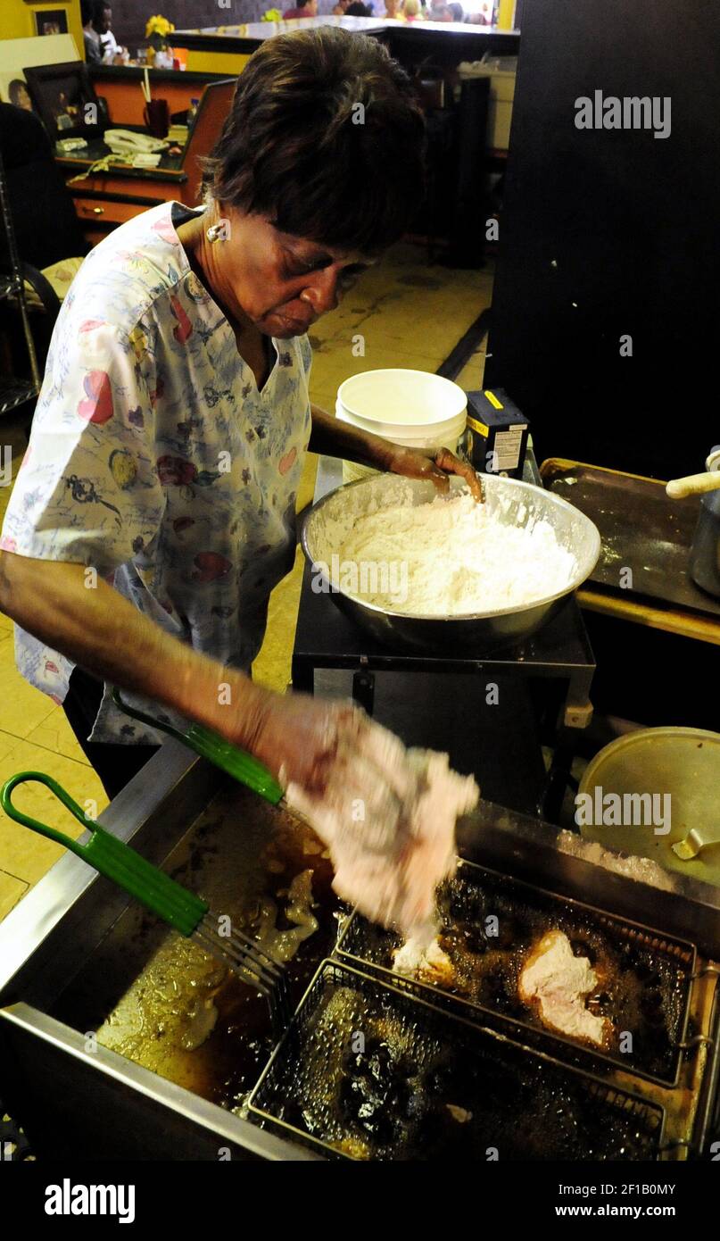 "Mama" Louise Hudson fries chicken at her H&H Restaurant in Macon ...