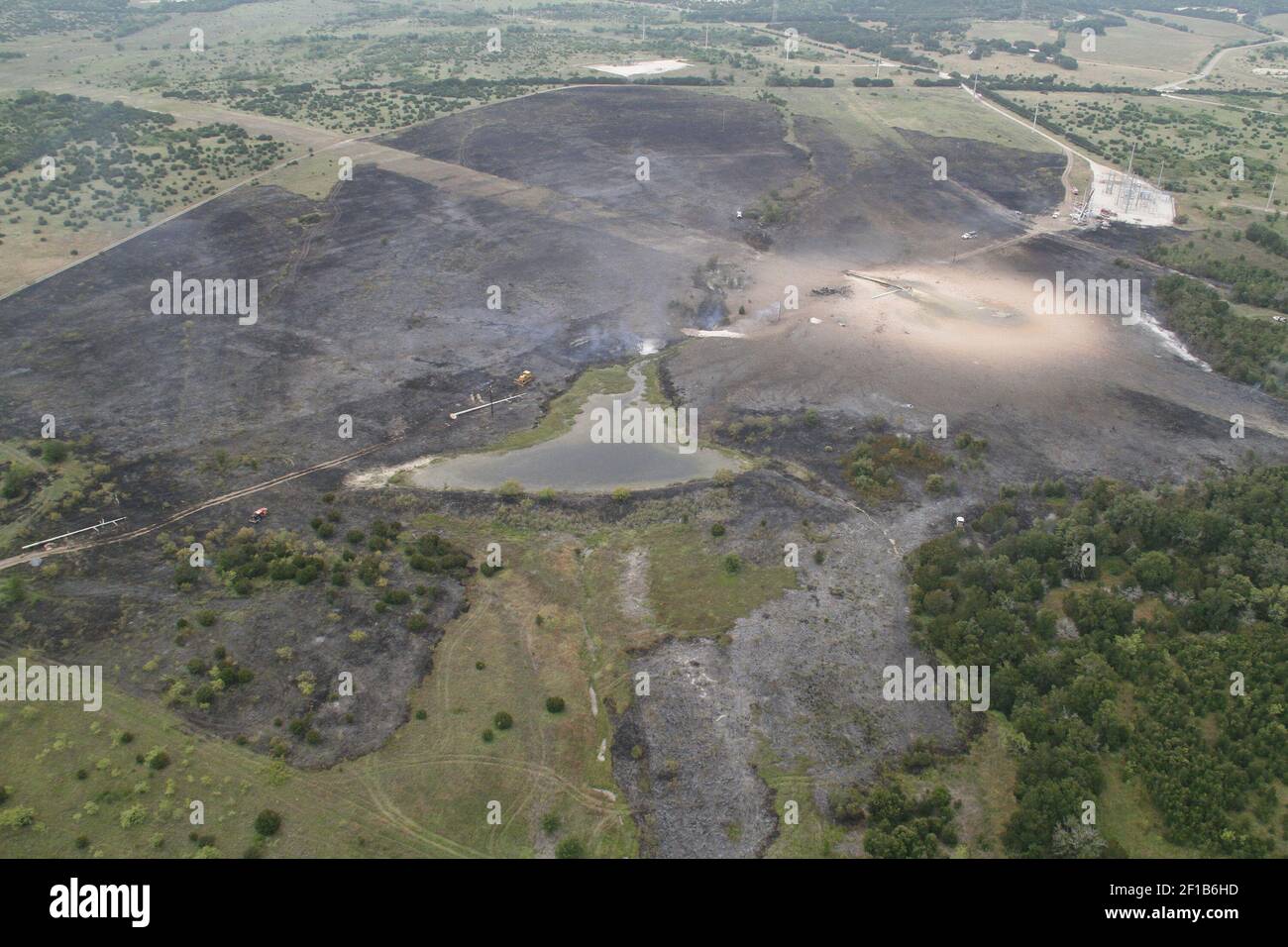 The blast scene is shown after a natural gas line exploded, Monday ...