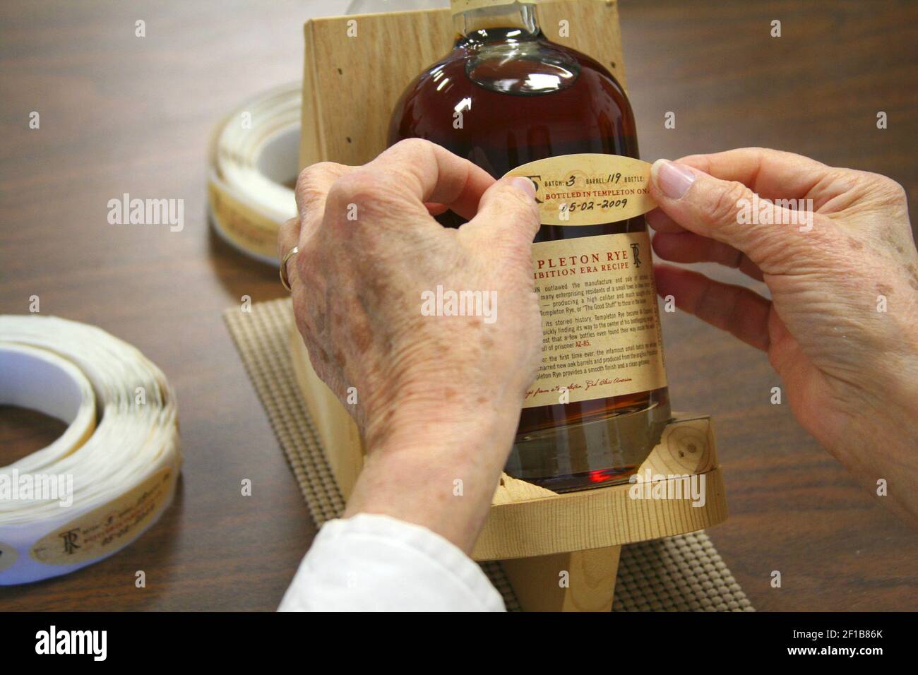 Every bottle of Templeton Rye whiskey is labeled by hand. (Photo by ...