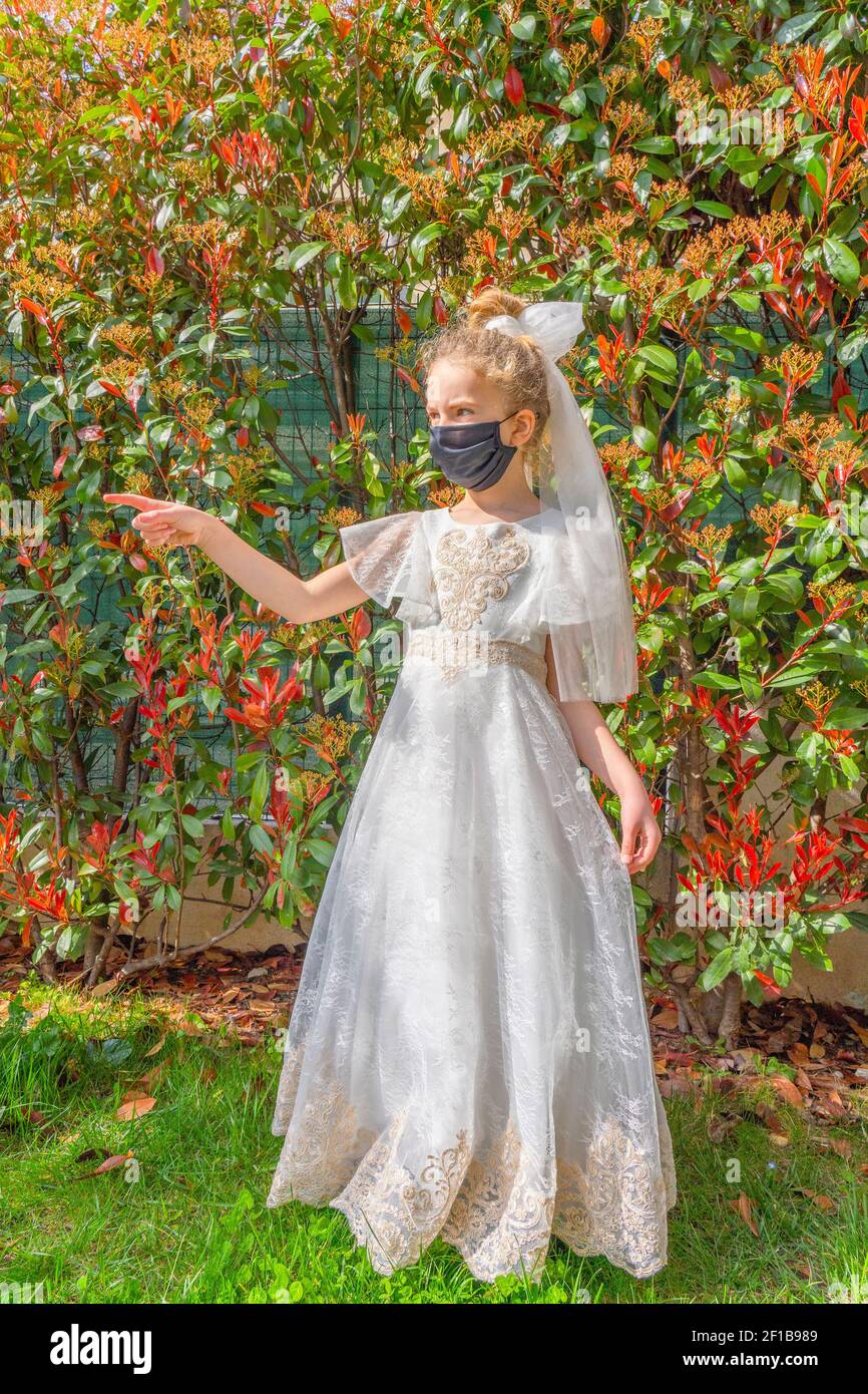 Beautiful model girl in a protective mask. Close-up of a young girl ...