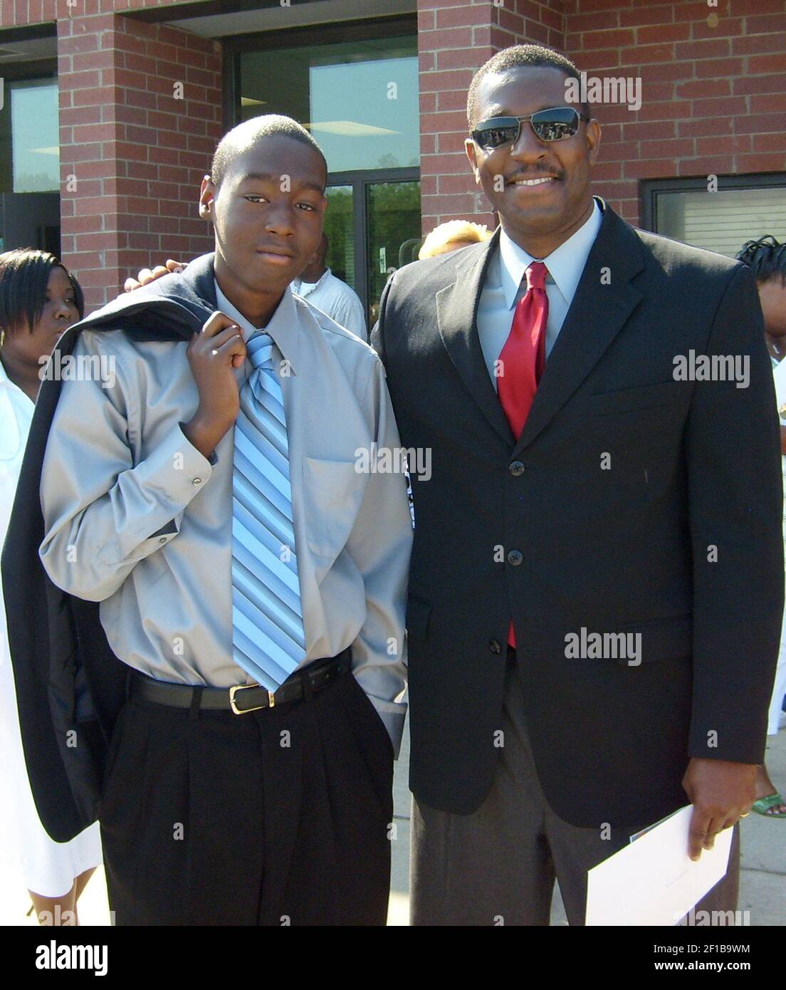 State Media Company reporter Wayne Washington, right, and his son Wayne ...