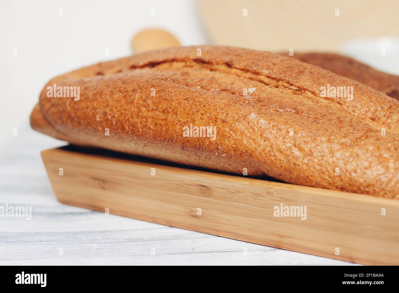 fresh loaf bread bins on the table kitchen food ration Stock Photo - Alamy