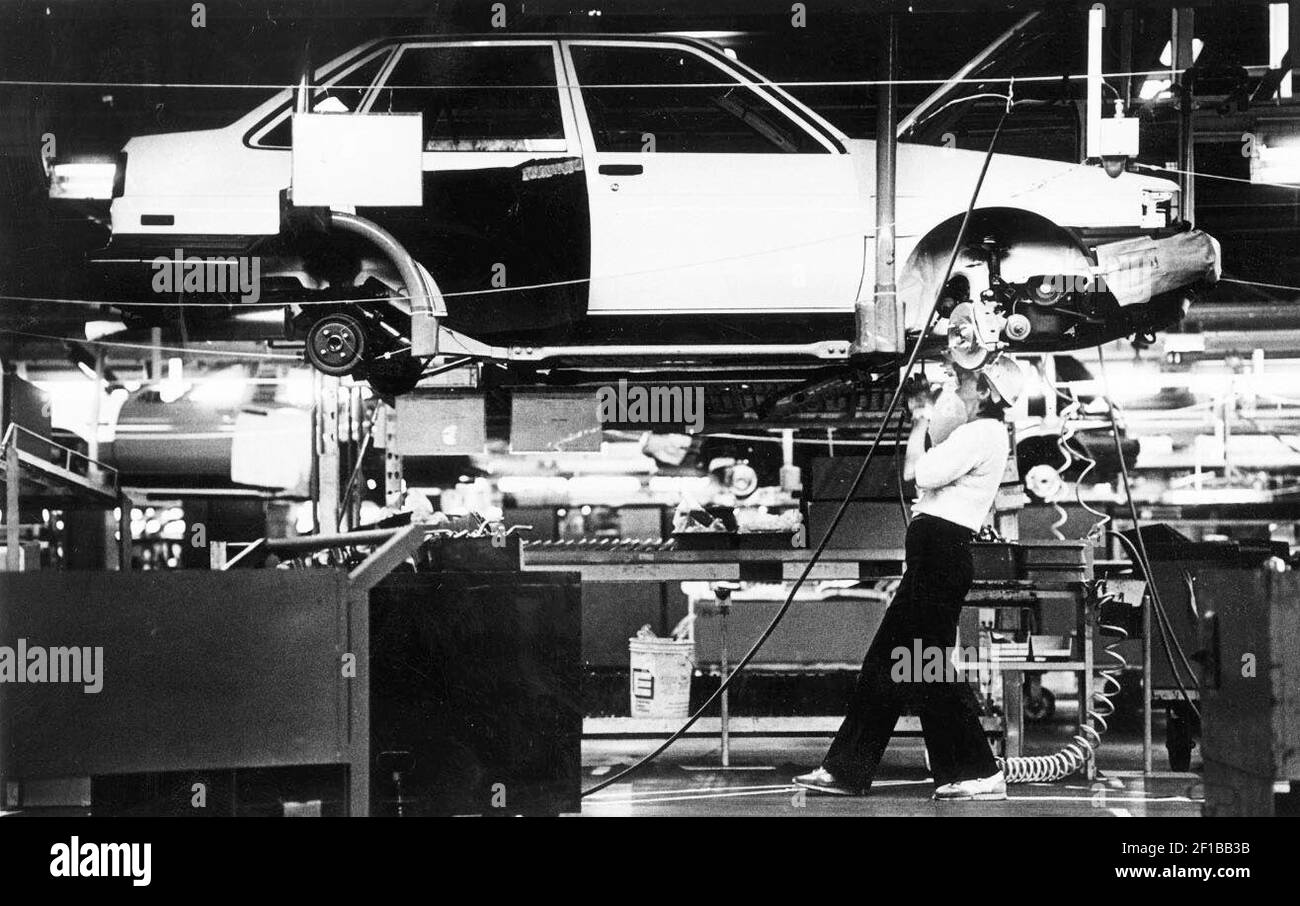 A NUMMI worker on the assembly line helps builds a Chevy Nova in ...
