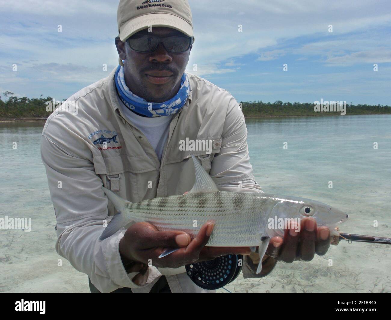 Fishing guide Alvin Greene holds a bonefish near central Andros Island ...