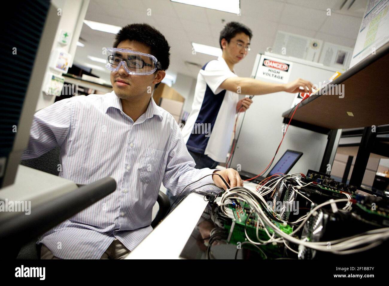Gangyao Wang, left, and Tiefu Zhao, electrical engineering Ph.D. students at North Carolina ...