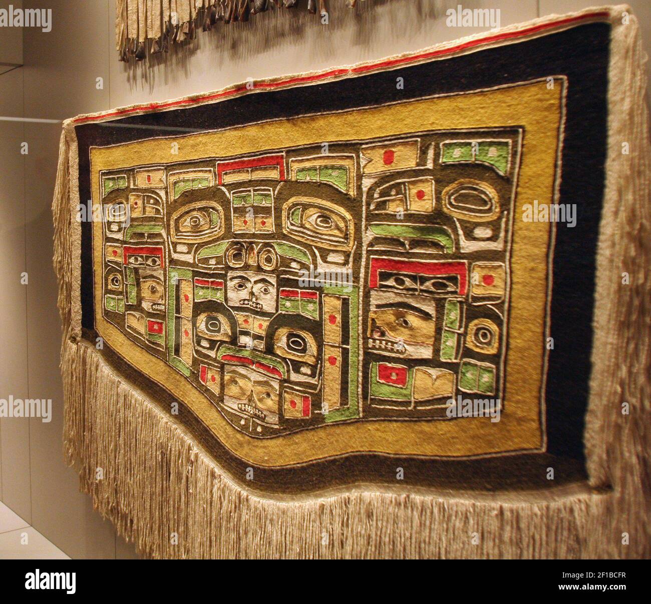 The Chilkat robe on display is unusual in its use of green, red and ...