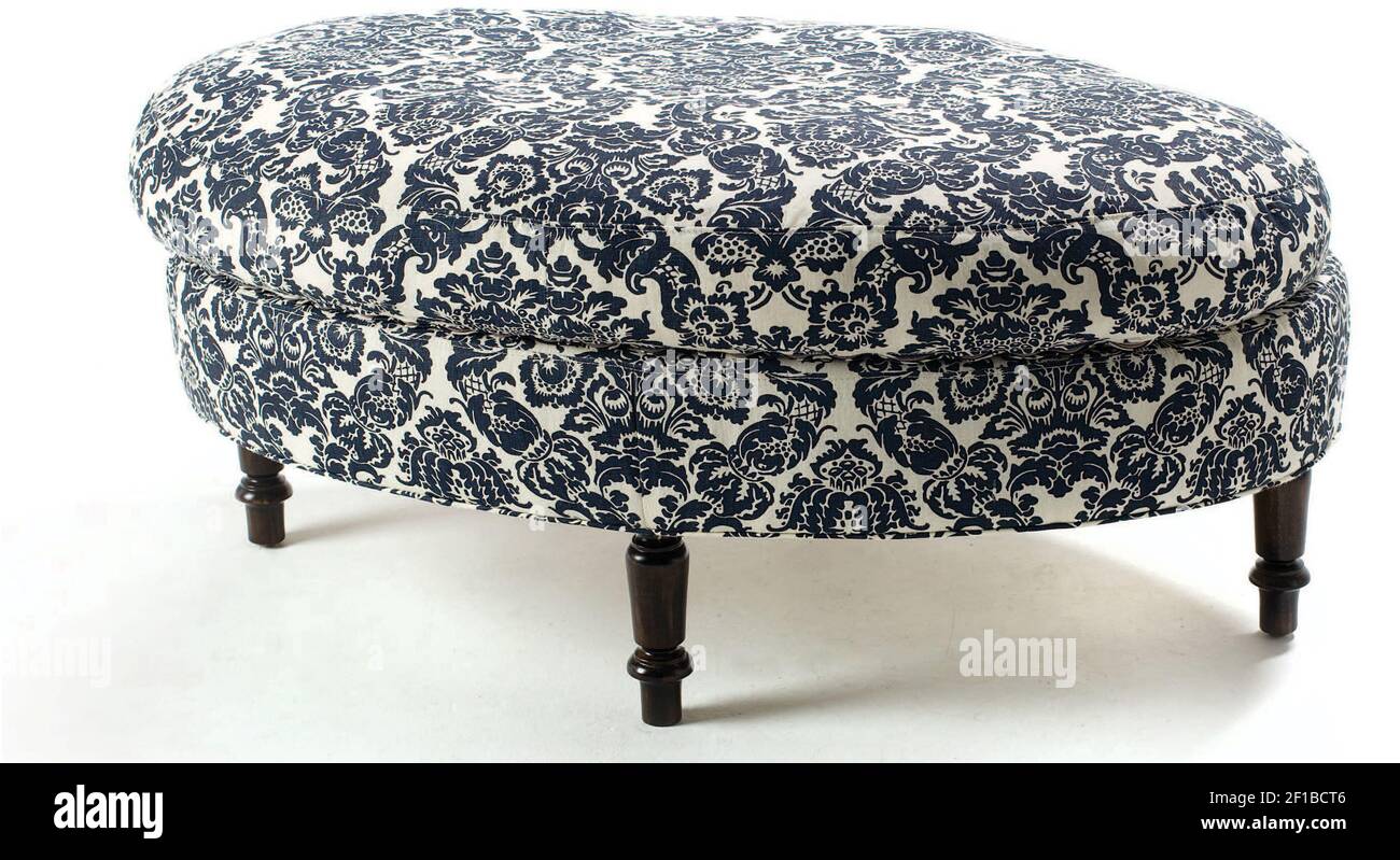 Ottomans aren't just for feet anymore. Their tufted tops can be tables ...
