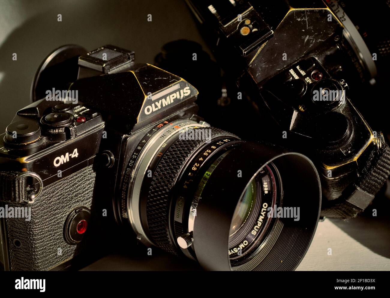 Two Olympus 35 mm film single lens reflex cameras Stock Photo - Alamy