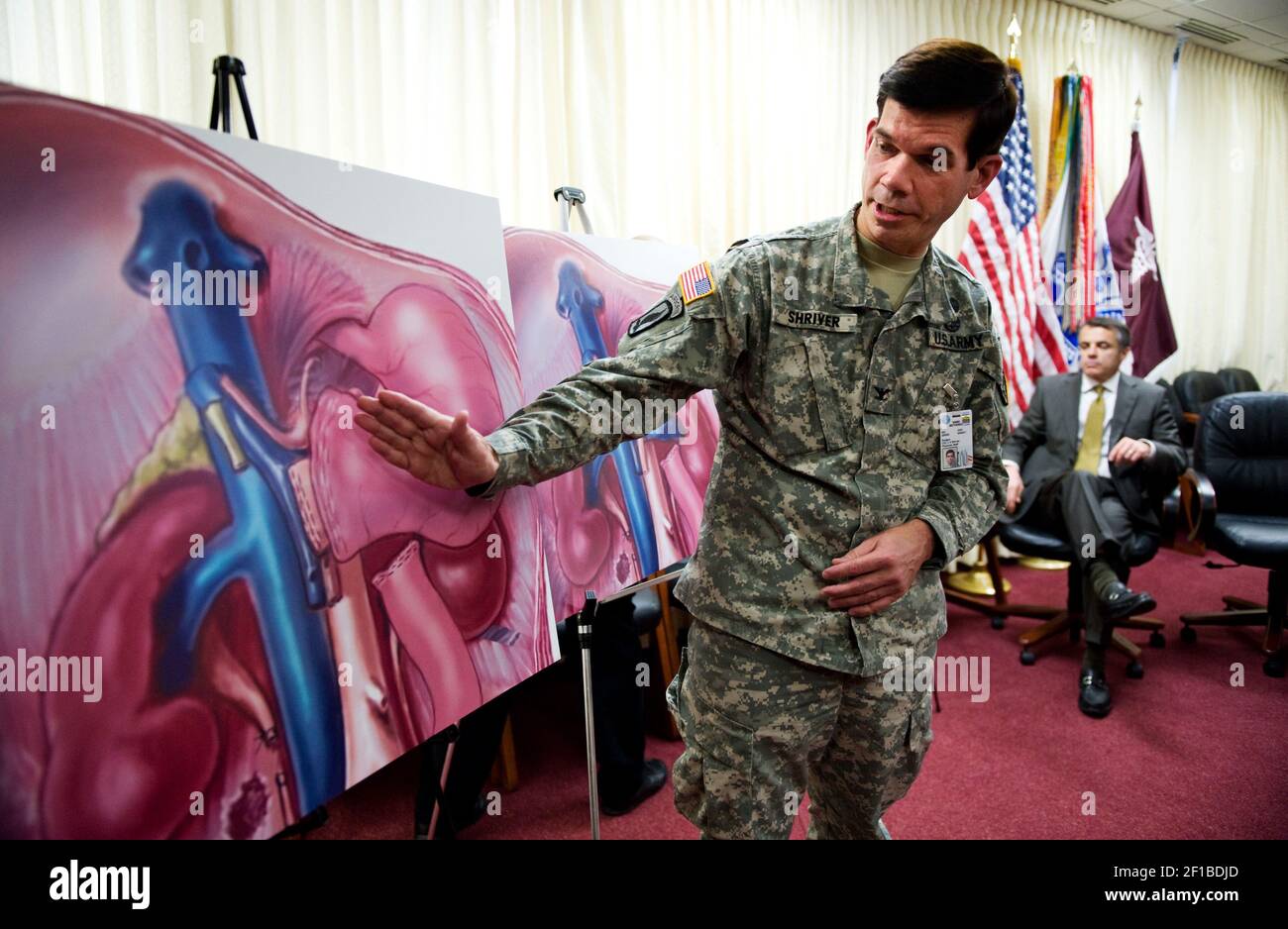 Army Dr. Craig Shriver, chief of general surgery, uses a diagram to ...