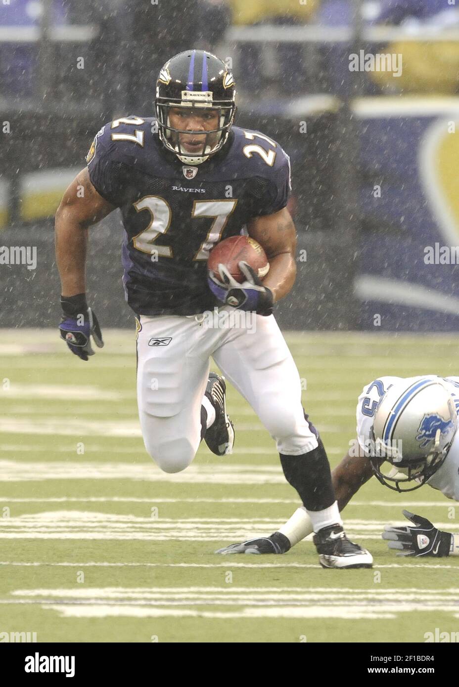 Baltimore Ravens' Ray Rice runs past Detroit Lions' Marvin White during ...