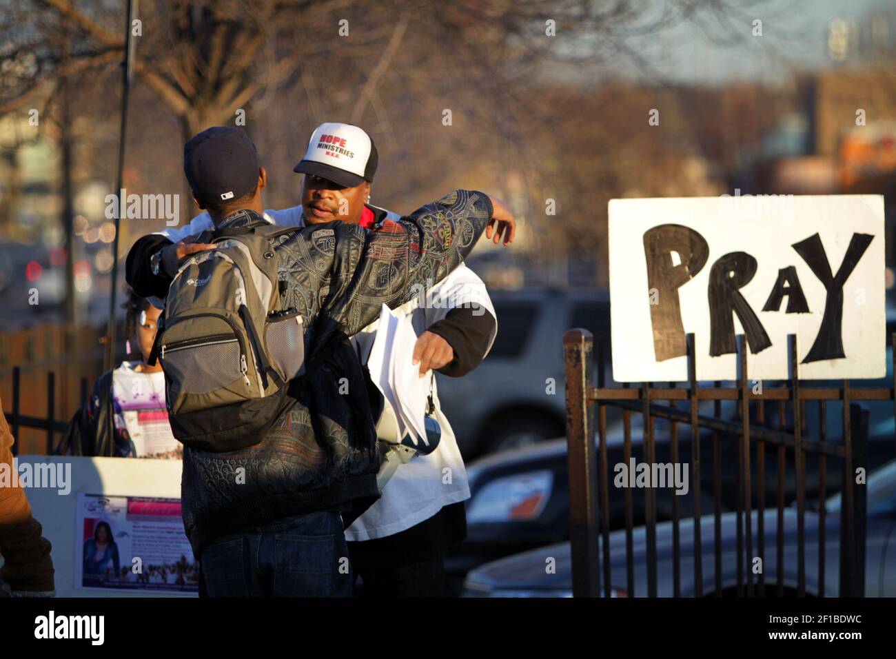 Minister K.G., as he is known on the street, gives a big hug to Marcus ...