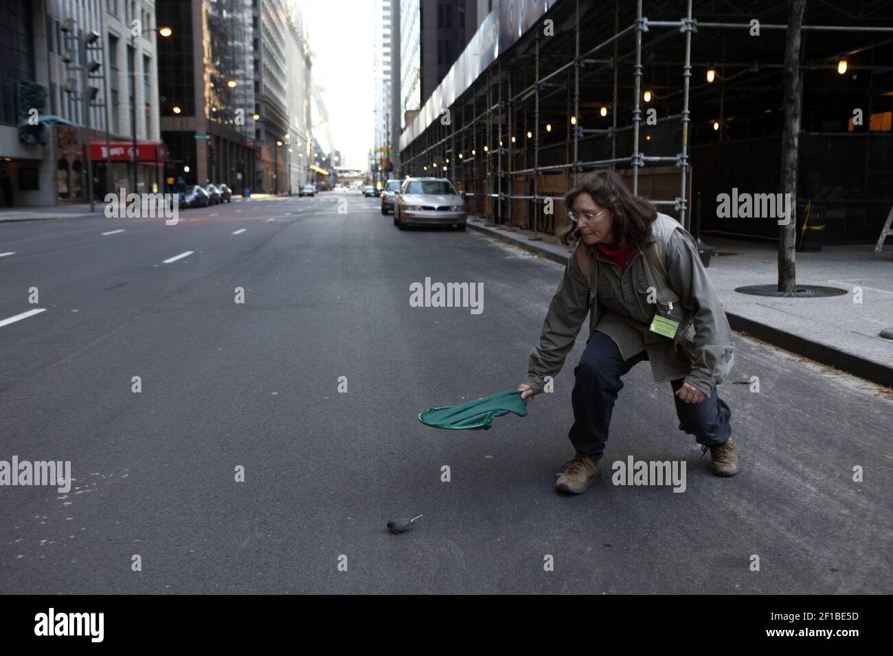 Annette Prince, of Chicago Bird Collision Monitors, sneak up on an ...
