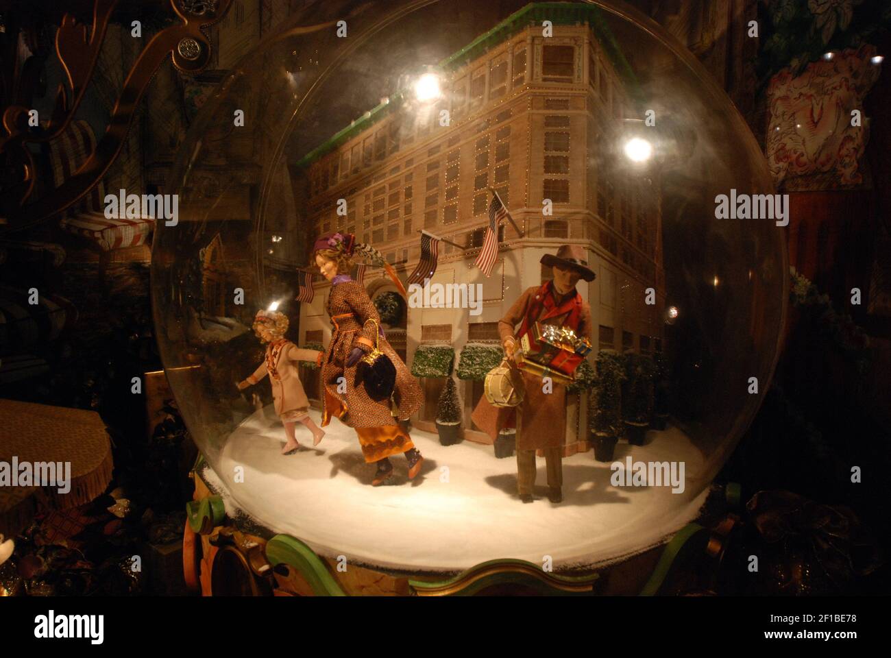 A snow globe is part of the holiday window displays at Lord & Taylor in ...