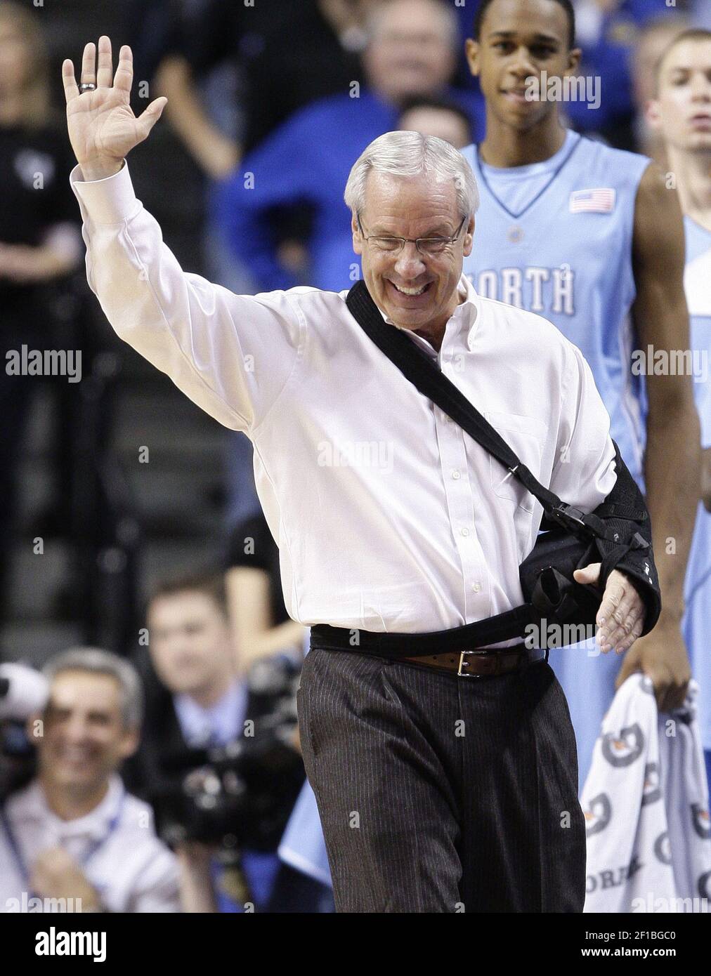 North Carolina coach Roy Williams laughed as he waved off an official's ...