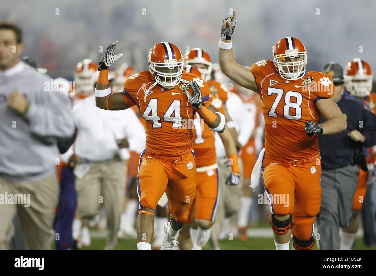 Clemson Scotty Cooper (44) and Ben Ramsey (78) run onto the field as ...