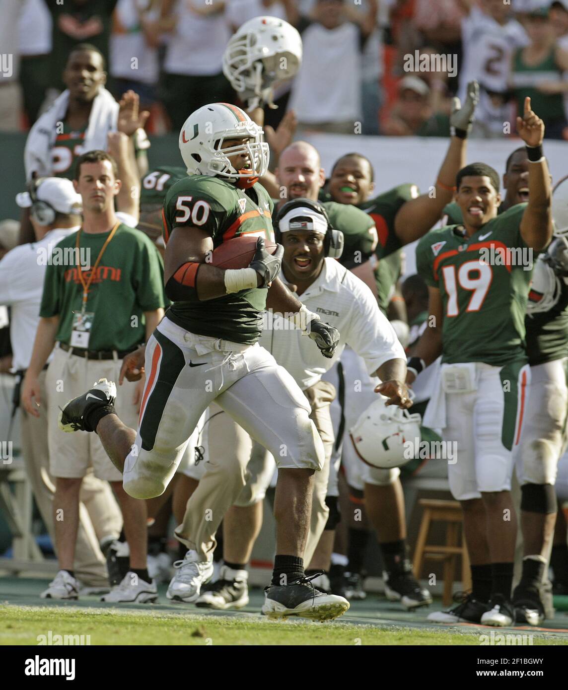 Miami linebacker Darryl Sharpton (50) returns an interception for a touchdown against Duke in ...