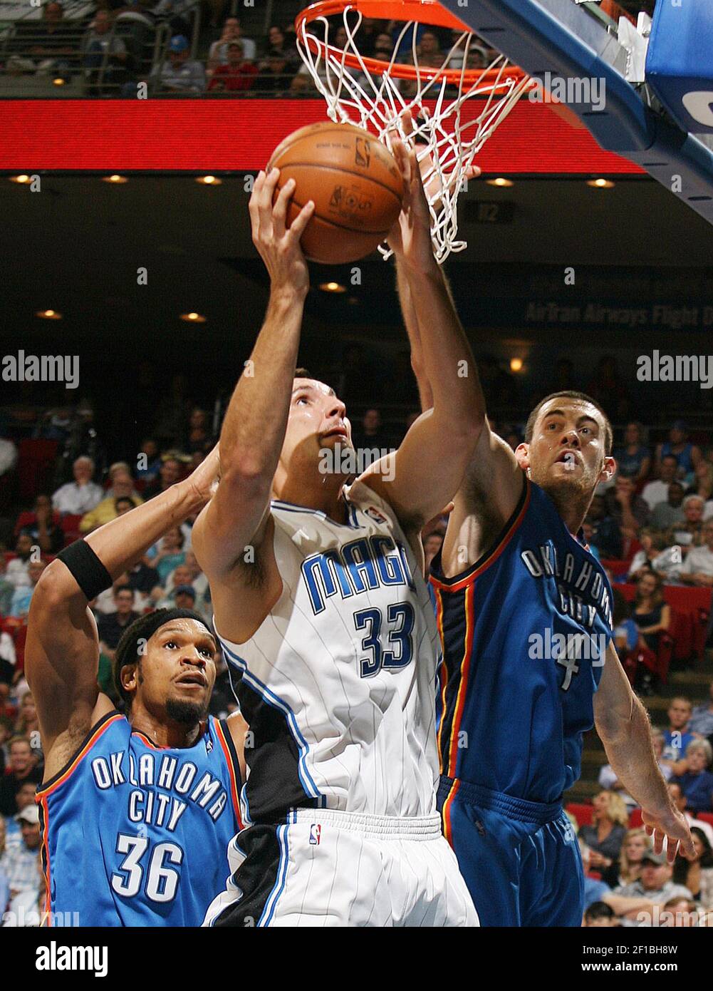 Orlando Magic forward Ryan Anderson scores against Oklahoma Thunder ...
