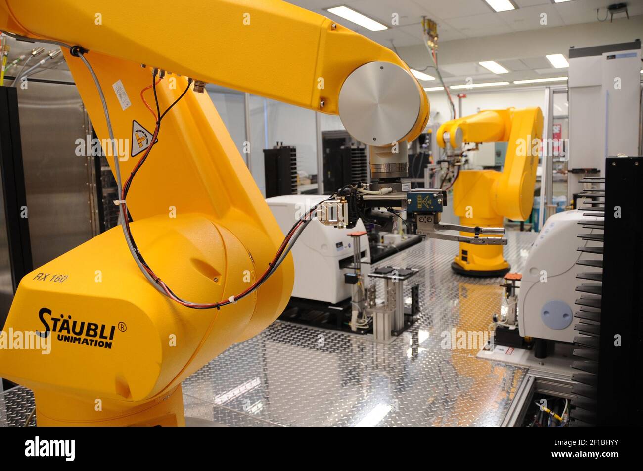 In a photo taken in September 2009, a robot arm (foreground) collects ...