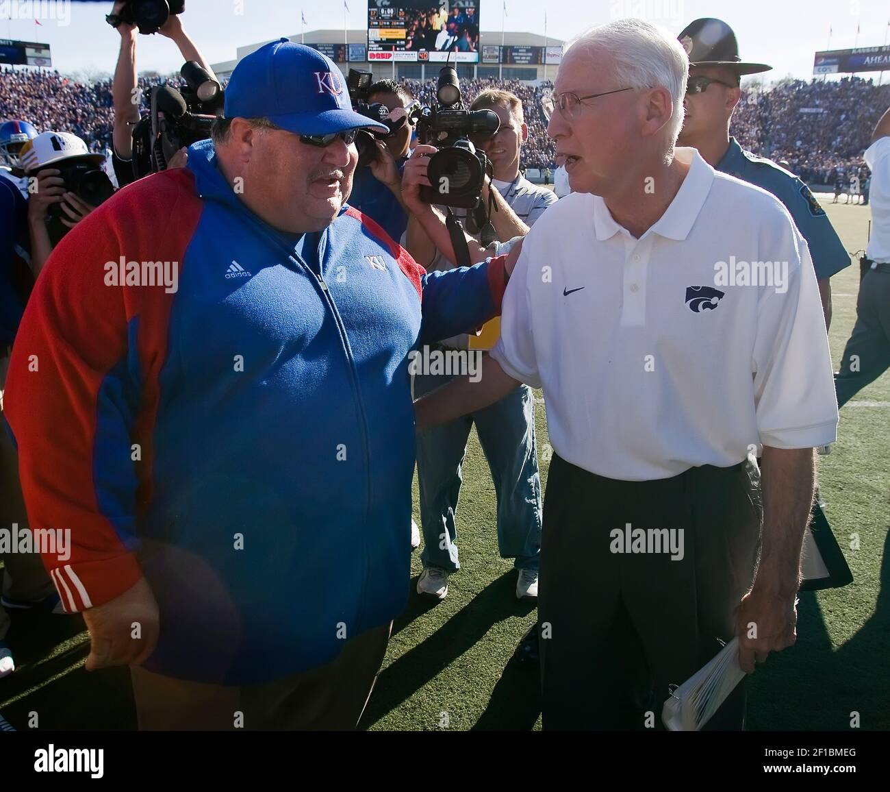 Kansas head coach Mark Mangino and Kansas State head coach Bill Snyder ...