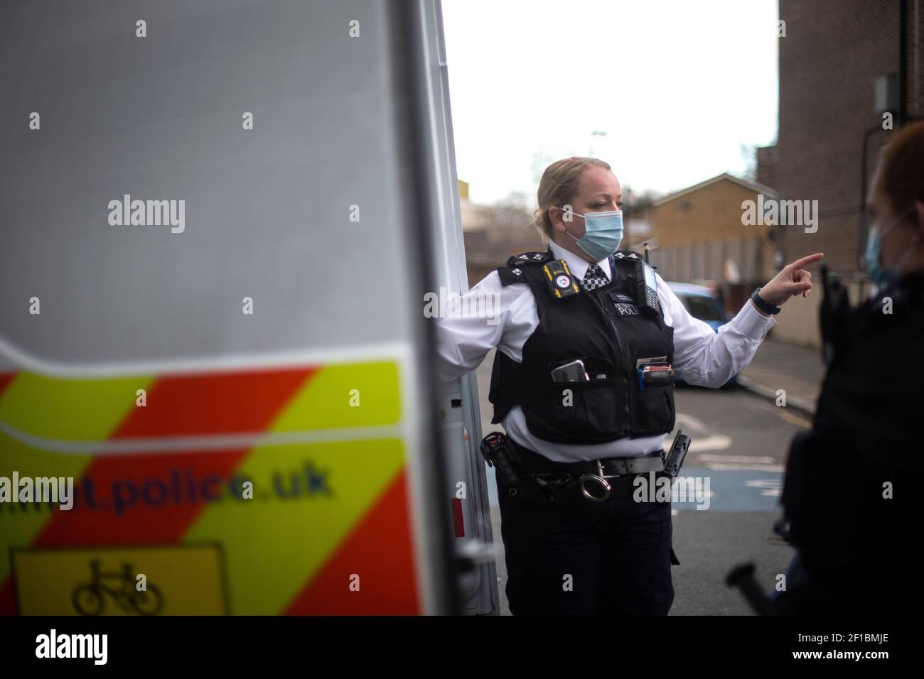 Police Sergeant Becky Perkins assists with taking a man into custody ...