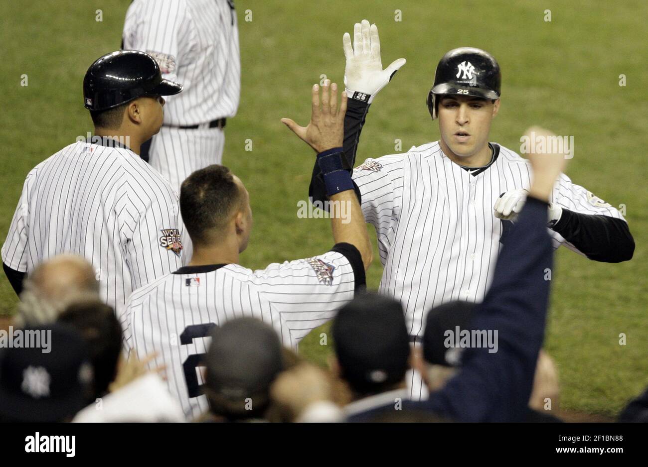 The New York Yankees' Derek Jeter and teammates greet Mark Mark ...