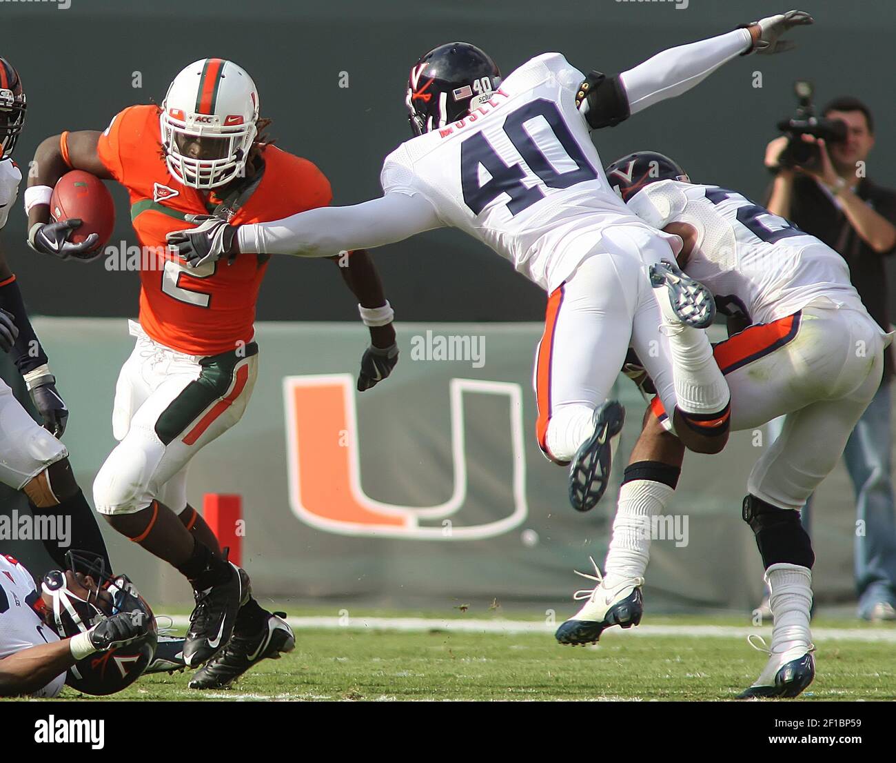 Miami's Graig Cooper breaks loose for a 70-yard gain against Virginia ...