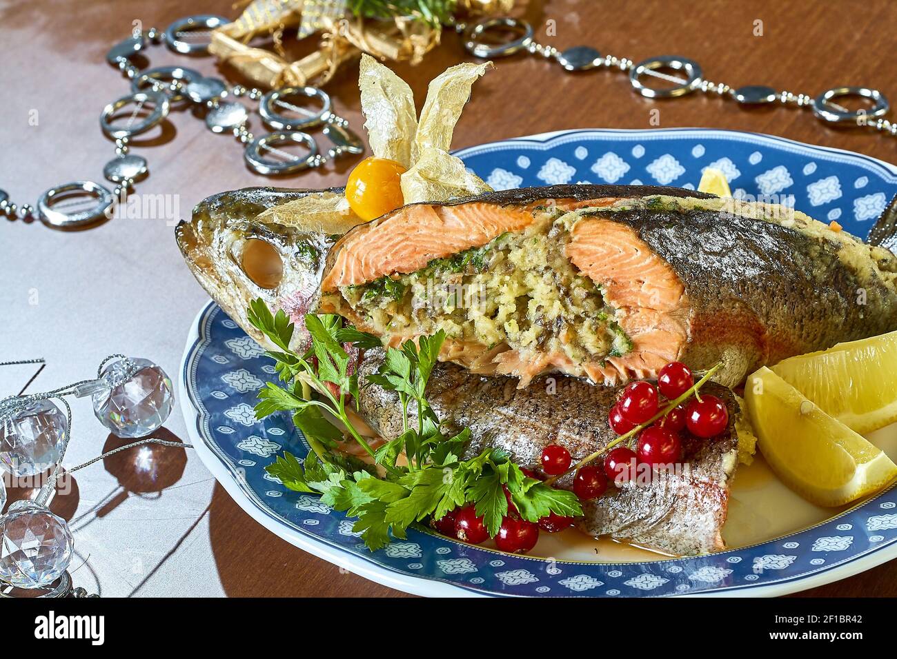 Fried stuffed fish on a platter festive menu Stock Photo - Alamy