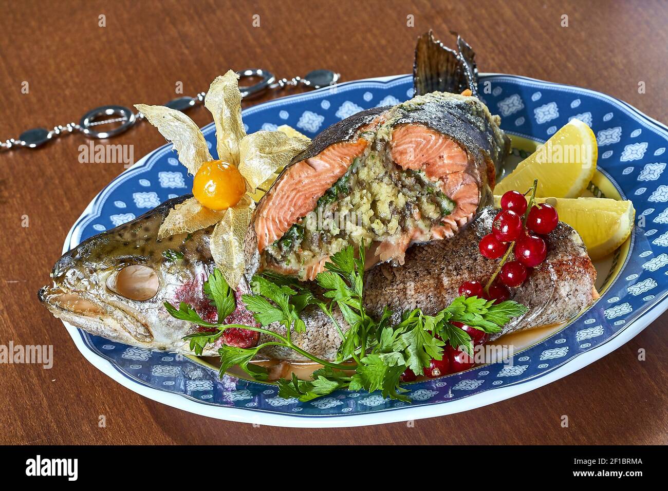 Fried stuffed fish on a platter festive menu Stock Photo - Alamy