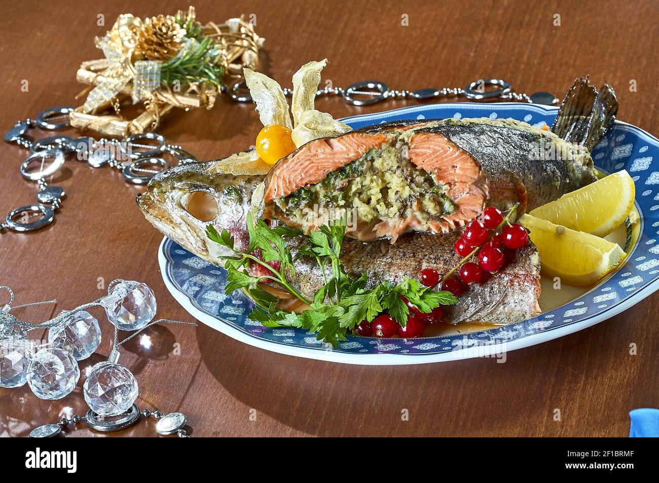 Fried stuffed fish on a platter festive menu Stock Photo - Alamy