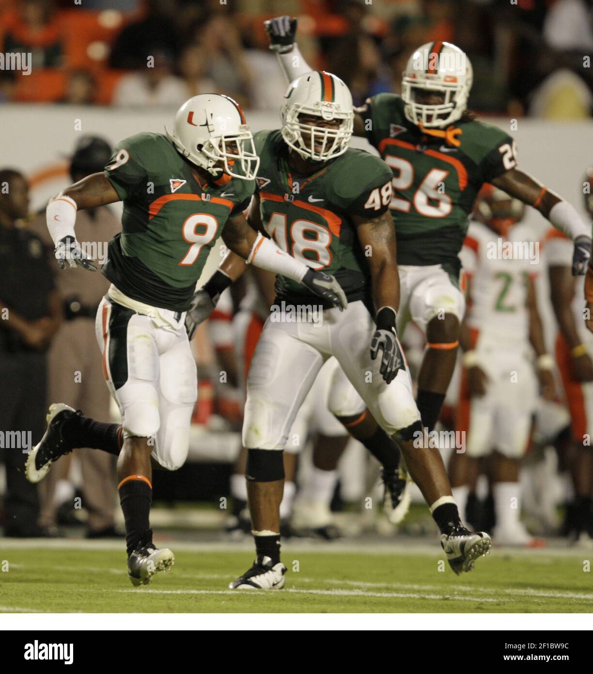 Miami's Sam Shields (9) celebrates with Andrew Smith (48) and Ray Ray ...