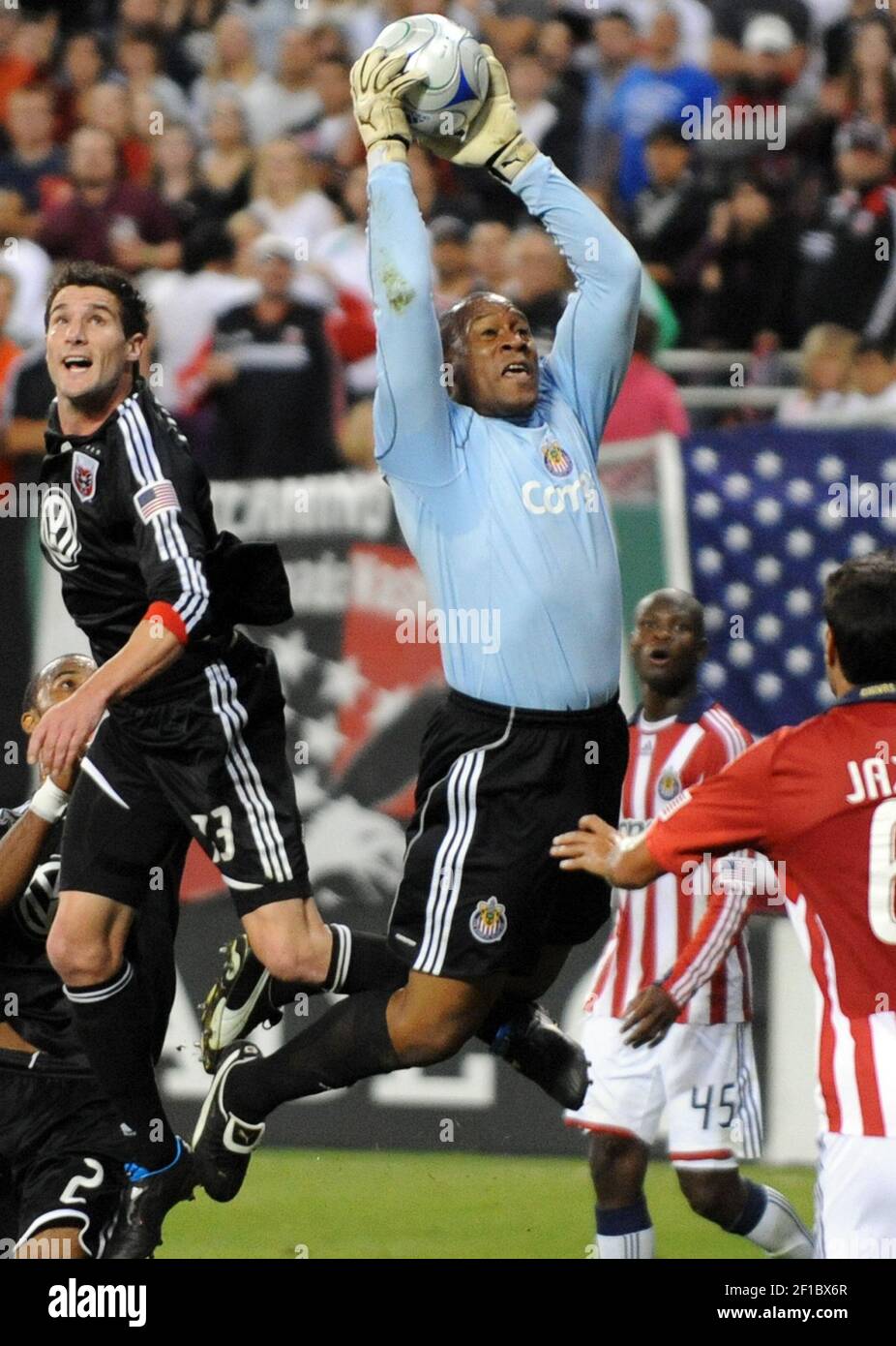 Chivas USA goalkeeper Zach Thorton, center, pulls down a D.C. United ...