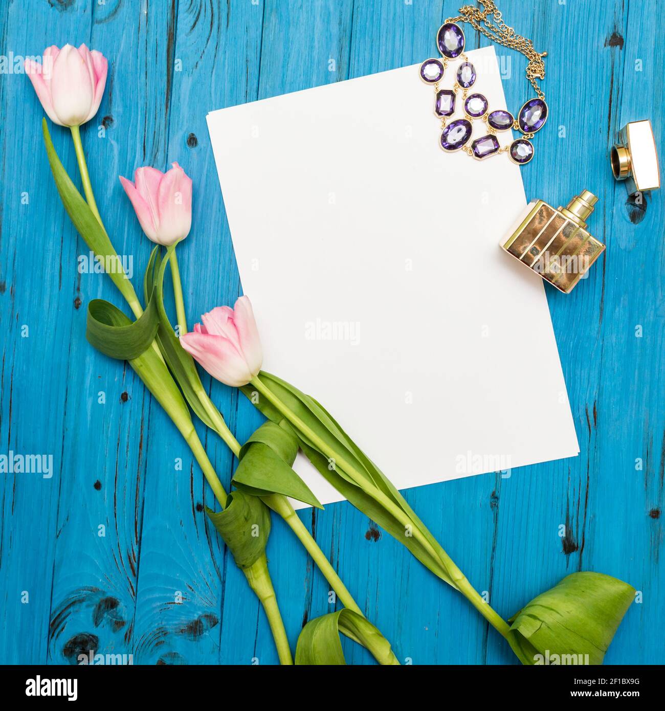 Pink tulips on a blue wooden board Stock Photo - Alamy