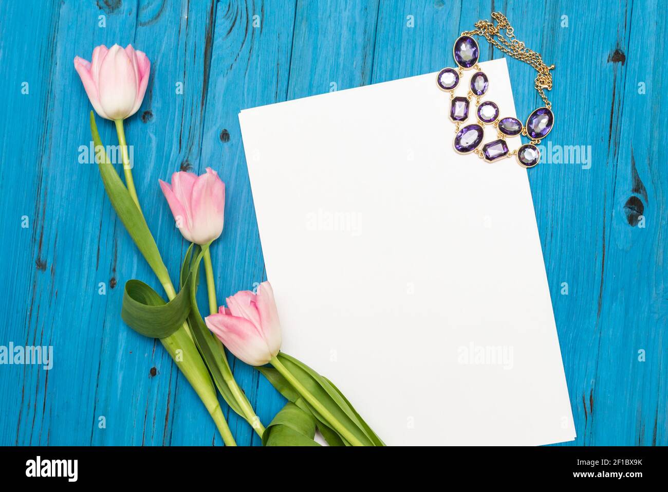 Pink tulips on a blue wooden board Stock Photo - Alamy