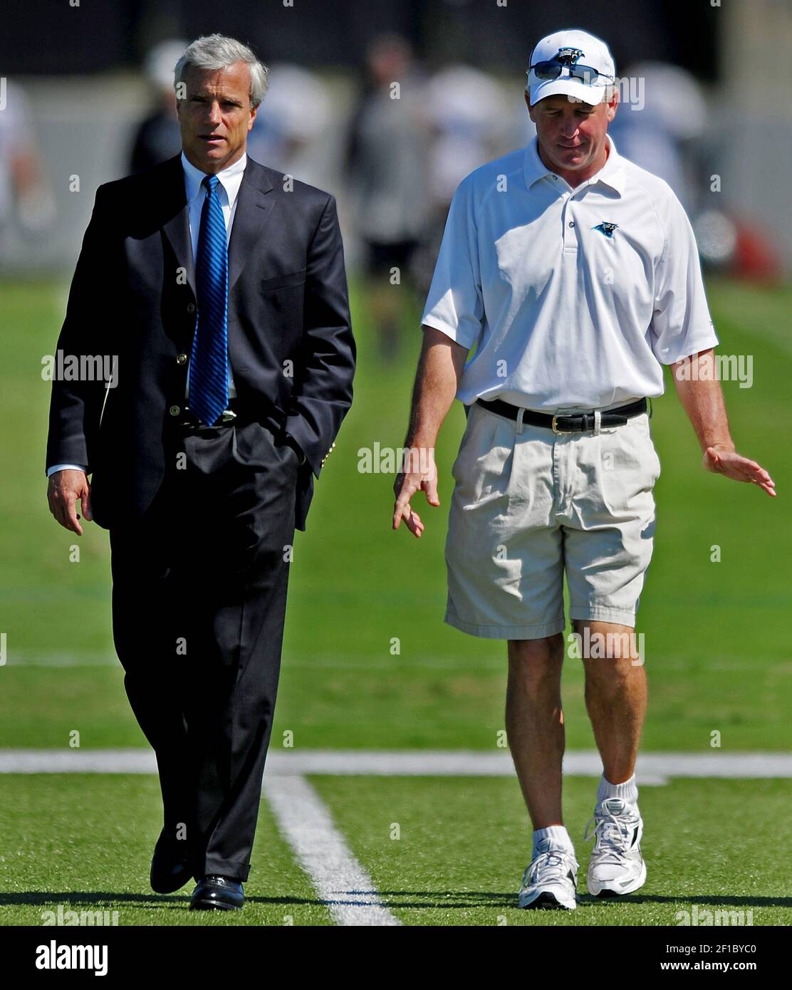 New Carolina Panthers president Danny Morrison, left, walks off the ...