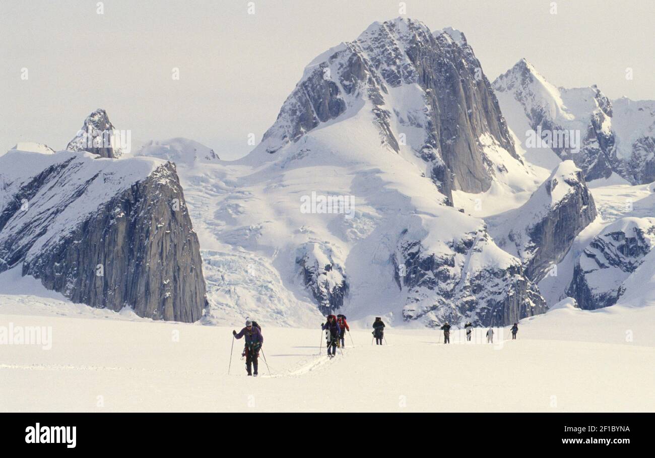 The Moose's Tooth formation is the backdrop for skiers as they traverse ...